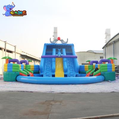China Outdoor PVC Inflatable Floating Castle Bounce House Dolphin Slide for sale