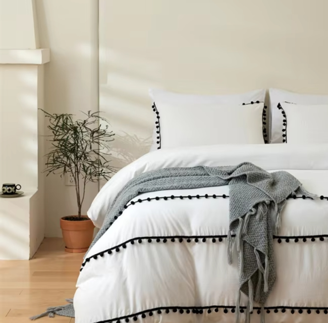 Luxury microfiber comforter set with pompom accents