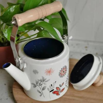 China Thickness 0.8mm Enamel Cooling Kettle With Wooden Handle Capacity Variants 1200ml And 2000ml Included for sale