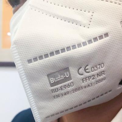 Cina Buda-U 5 mette a strati la maschera polverizzata del respiratore FFP2 misura molto attentamente al fronte in vendita