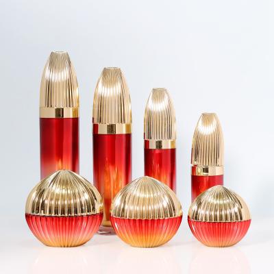 China Garrafas de plástico de cosméticos com gradiente de ouro vermelho 50g frasco de creme forma esférica material do colarinho acrílico à venda