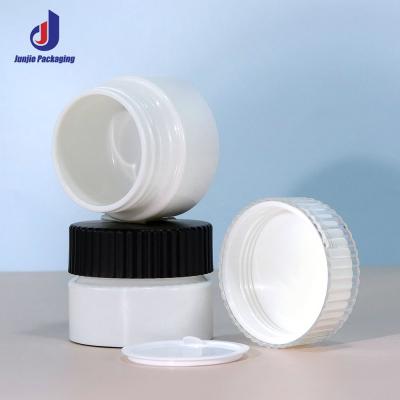 China 120g frascos de creme branco forma redonda frascos de plástico personalizados para creme à venda