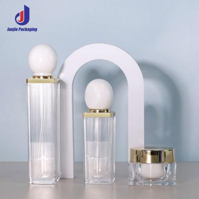 China Cosmetic Acrylic Bottles 30g 50g Plastic Lotion Bottles Packaging With Special Stone Cover Cap for sale