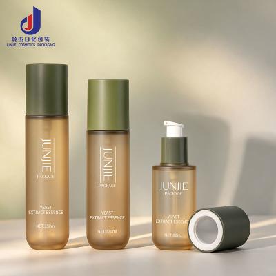 China Custom Cosmetic Packaging Green Frosted High Quality UV Printed PETG Pump Sprayer Bottle 30-150ml Plastic Lotion Bottle for sale