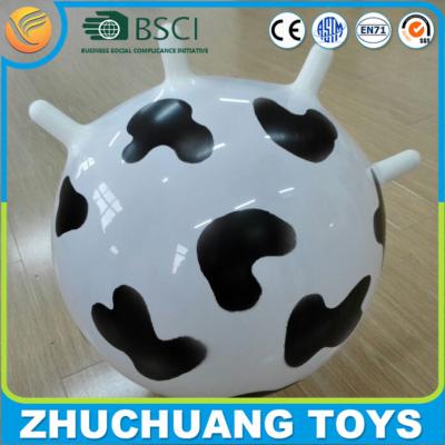 China milk cow pattern gymnic hopper balls with handles for sale
