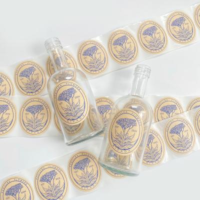China Customized Texture Adhesive Sticker Round Label Roll for Food Packaging for Essential Oils and Glass Bottles for sale