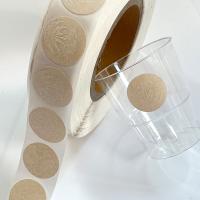 China Custom Round Embossed Logo Texture Paper Label Sticker Roll for sale