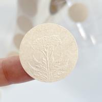 China Custom Round Embossed Logo Texture Paper Label Sticker Roll for sale