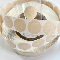 China Custom Round Embossed Logo Texture Paper Label Sticker Roll for sale