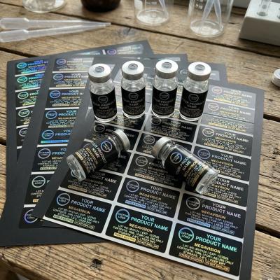 China Custom Printing Holographic Laser Self Adhesive Logo Sticker Roll for Glass Vial Bottle Labels for sale