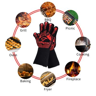 Cina I guanti di funzionamento della sicurezza del silicone del commestibile grigliano il premio termoresistente estremo dei guanti del BARBECUE della griglia dell'aiuto del calore isolati in vendita