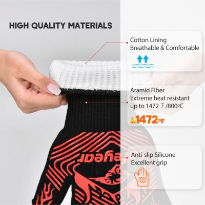Cina I guanti di funzionamento della sicurezza del silicone del commestibile grigliano il premio termoresistente estremo dei guanti del BARBECUE della griglia dell'aiuto del calore isolati in vendita