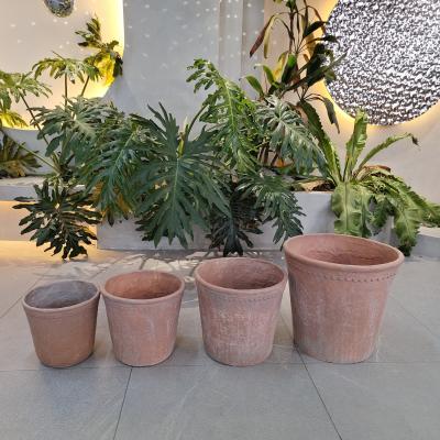 China Durable Fiber Clay Planter With Hand Carved Finish Round Texture Surface for sale