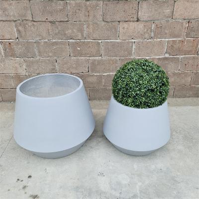 China Beautifully Crafted Fiber Clay Planter For Your Greenery Collection for sale