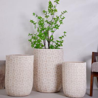 Cina piantatore di argilla di fibra rotonda beige neutrale con tessuto a griglia tessuto leggero durevole a bassa manutenzione vaso da fiore vacanza villa hotel centro commerciale decorazione ufficio giardino progetto di paesaggio in vendita