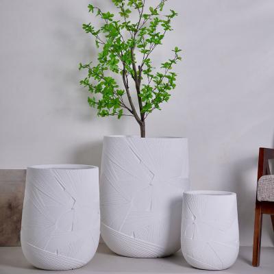 Cina fioriera rotonda in fibra di argilla bianca neutra con motivo geometrico radiale leggera resistente a bassa manutenzione vaso di fiori vacanza Villa hotel centro commerciale decorazione ufficio progetto di giardinaggio in vendita