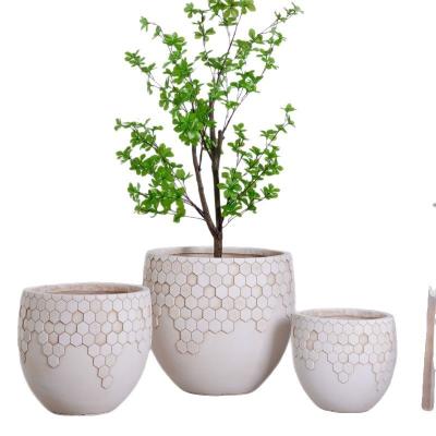 中国 中性ベージュ 丸い繊維粘土の植樹 蜂巣構造のパターン 軽量 耐久性 低保守性 花盆 休日 ビラ ホテル ショッピングモール オフィス 装飾 庭園 景観設計 プロジェクト 販売のため