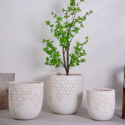 China neutral beige round fiber clay planter with natural honeycomb pattern lightweight durable low-maintainence flower pot holiday Villa hotel shopping mall office decoration garden landscaping project for sale