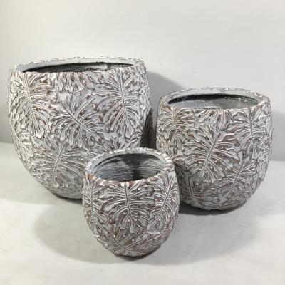 중국 GRC 냄비 회색 둥근 섬유 시멘트 플랜터 몬스테라 잎 디자인 패턴 가벼운 내구성 낮은 유지 보수 꽃 냄비 휴가 빌라 사무실 장식 지붕 정원 조경 프로젝트 판매용