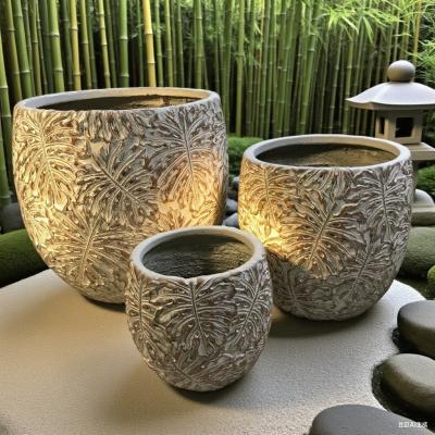 중국 GRC 냄비 회색 둥근 섬유 시멘트 플랜터 몬스테라 잎 디자인 패턴 가벼운 내구성 낮은 유지 보수 꽃 냄비 휴가 빌라 사무실 장식 지붕 정원 조경 프로젝트 판매용