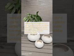 neutral beige natural speckled stone -mimic design round fiber clay planter earthy aesthetic lightweight durable low-maintainence flower pot holiday Villa office decoration garden landscaping project