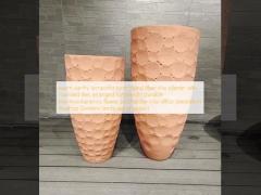 warm earthy terracotta tone round fiber clay planter with rounded tiles arranged lightweight durable low-maintainence flower pot holiday Villa office decoration Rooftop Gardens landscaping project