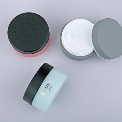 China 50ml Customized Cosmetic Jar Soft Touch Plastic Cosmetic Cream Jar Two Color With Stone Texture Cap for sale