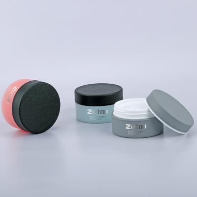 China 50ml Customized Cosmetic Jar Soft Touch Plastic Cosmetic Cream Jar Two Color With Stone Texture Cap for sale