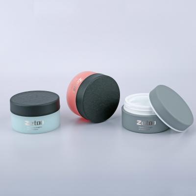 China 50ml Customized Cosmetic Jar Soft Touch Plastic Cosmetic Cream Jar Two Color With Stone Texture Cap for sale