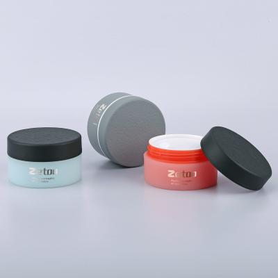 China 50ml Customized Cosmetic Jar Soft Touch Plastic Cosmetic Cream Jar Two Color With Stone Texture Cap for sale
