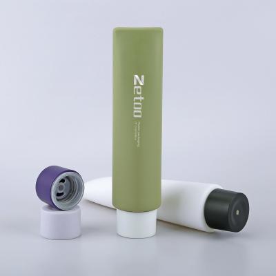 China 120ml Plastic Cosmetic Bottle Soft Touch Custom Made Cosmetic Containers With Center Dispensing Cap for sale