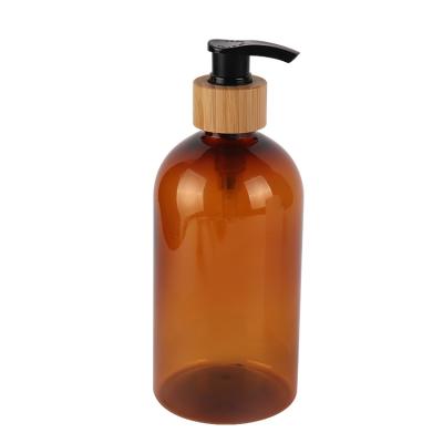 Cina 200 ml 300 ml 500 ml Bottiglia ricaricabile di lozione Amber con pompa di lozione di bambù naturale in vendita