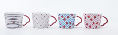 China Valentine Heart Pattern Ceramic Mug Set with Red Curved Handle, 4-Piece Romantic Love Themed Coffee Cup Collection for sale