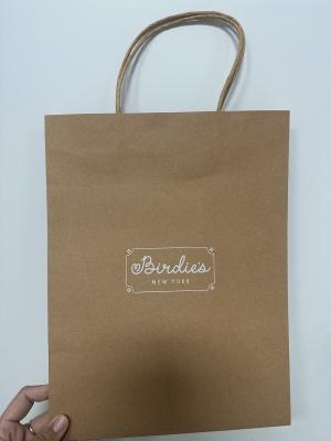 China Custom Kraft Paper Bag with Logo Printing Available in Various Sizes and Shapes Suitable for Retail Packaging Needs for sale