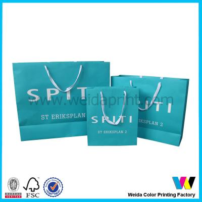Cina Sacchetti della spesa di carta stampati blu su ordinazione con la corda del nastro UV in vendita