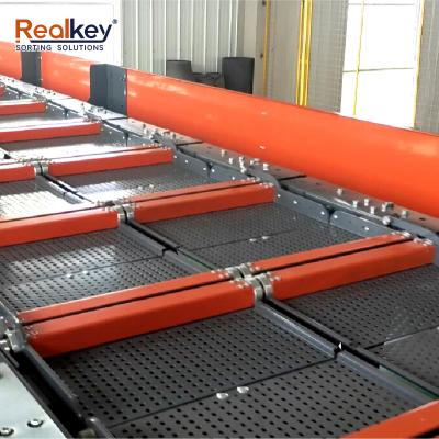 China High-Speed Split Tray Sorter with 99.99% Accuracy and Fire Resistant Material for Ecommerce Warehouses for sale