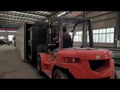 Hoe de hooklift in een container wordt geladen