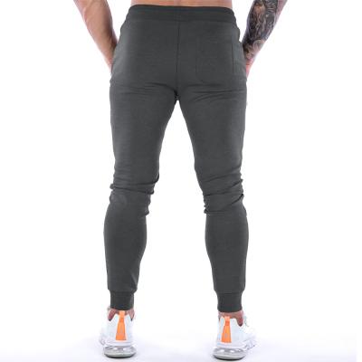 China S faz sob medida 98cm os homens do comprimento que ostentam caneleiras, caneleiras da compressão dos homens com bolsos do fecho de correr à venda
