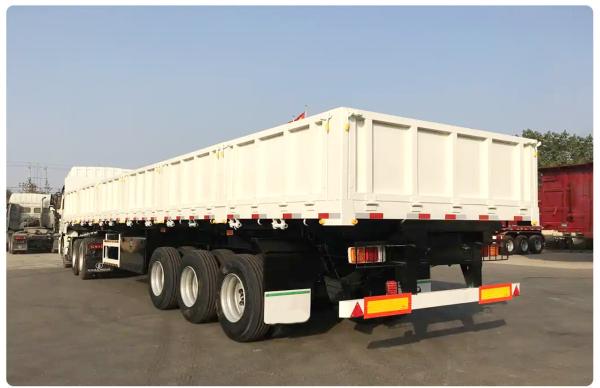 CIMC Tri asse Side Tipper 70 tonnellate consente di scaricare le merci dal lato di trasporto di materiali da costruzione scarico semirimorchio