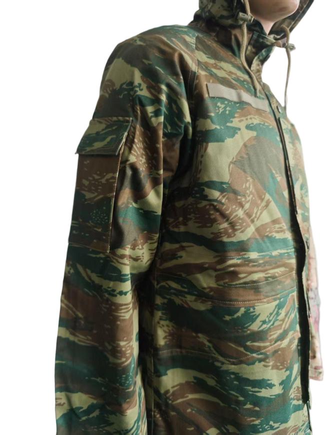 Camouflage training top side view showing arm pockets
