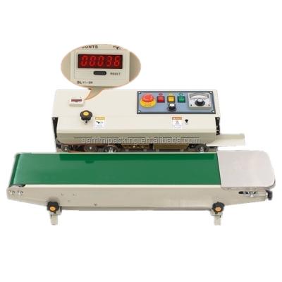 Cina Macchina di sigillatura verticale semiautomatica, macchina di sigillatura a banda continua per piccoli sacchetti alimentari in vendita
