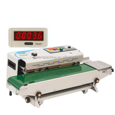 Cina Macchina di sigillatura verticale semiautomatica, macchina di sigillatura a banda continua per piccoli sacchetti alimentari in vendita