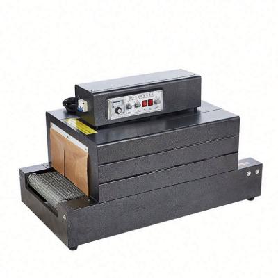 Китай Горячая продажа Маленькая пластиковая пленка Тепловая туннель Сжимается режущая упаковочная машина для бутылки/коробки Легко работать продается