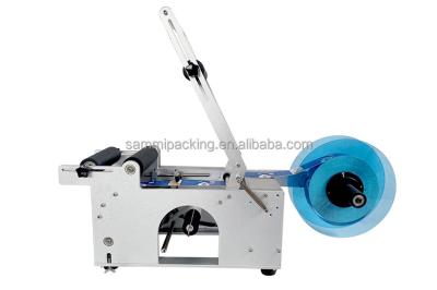 Cina MT-50 Etichettatrice semiautomatica per bottiglie rotonde, macchina etichettatrice per lattine e bottiglie di bevande in vendita