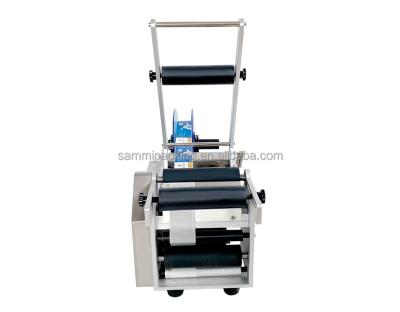 Cina MT-50 Etichettatrice semiautomatica per bottiglie rotonde, macchina etichettatrice per lattine e bottiglie di bevande in vendita