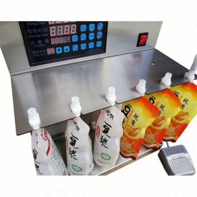 China Semi Automatic Spout Pouch Juice Liquid Soybean Milk Self-supporting Bag Filling Packing Machine for sale