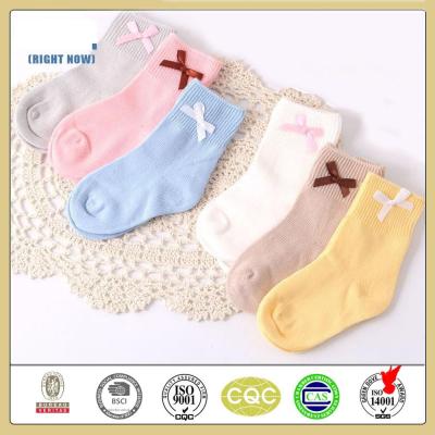 China Elegant high quality custom plain color bowknot cotton baby socks for sale