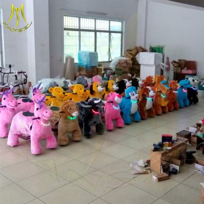 中国 Hansel coin operated horse ride motorized riding toys rohs standard luck cow electric motorized scooter with rich toys 販売のため