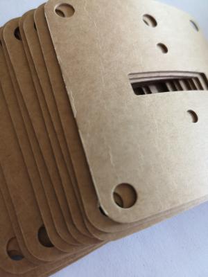 China Garrafa de papel isolante de corte a dedo de precisão - almofada de cartão de fibra Kraft de alta resistência com vários furos para aplicações elétricas, automotivas e de hardware à venda