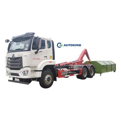 Cina 4X2 Drive Wheel Chinese HOWO 6-8 CBM Hook Arm Hydraulic Lift Containers Garbage Truck For Environmentally Friendly Hotels in vendita